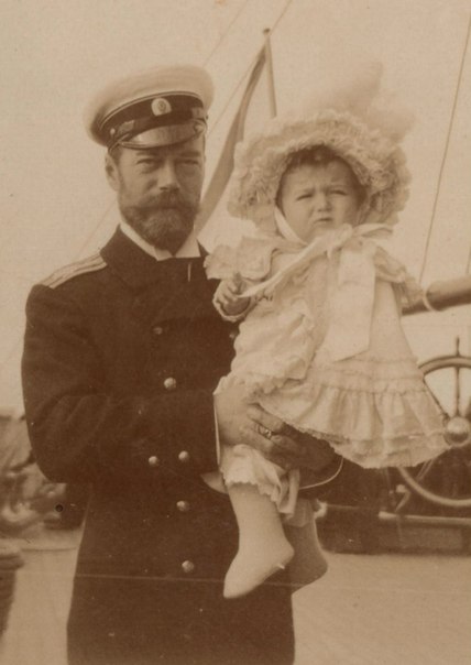 Nicholas II holding up his son Alexei – in a pretty little dress ...