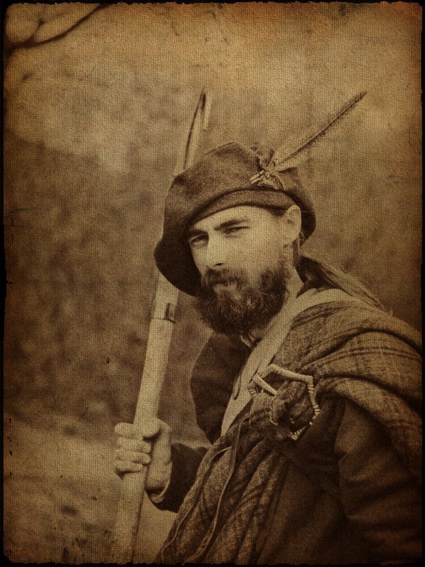 Bearded man with a feather in his cap | MATTHEW'S ISLAND