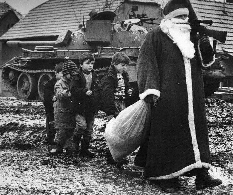 Santa, with a high powered rifle for protection, delivering presents in ...