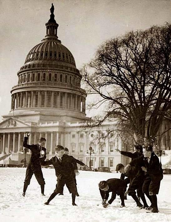 Senate pages having a snowball fight outside the US Capitol, Washington ...