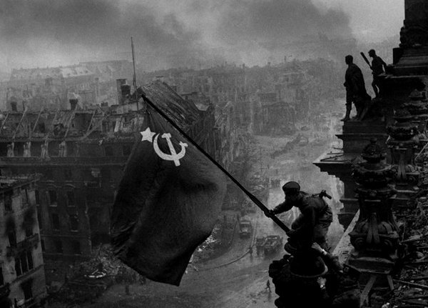 Soviet flag flying over a destroyed Berlin at the end of WWII, 1945 ...